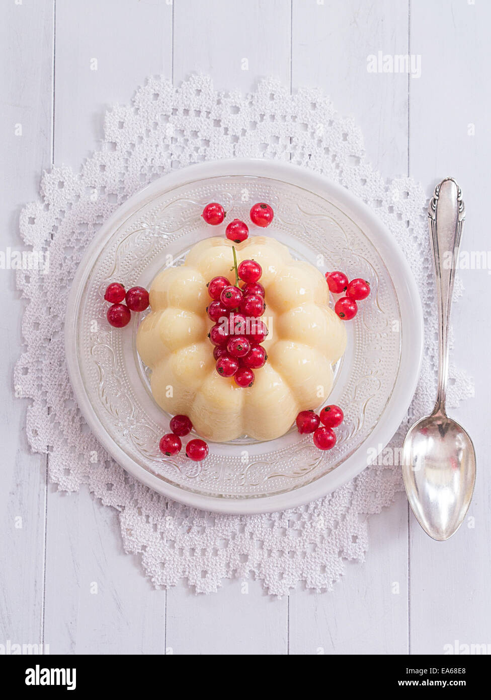 Vanilla pudding with red currants Stock Photo - Alamy
