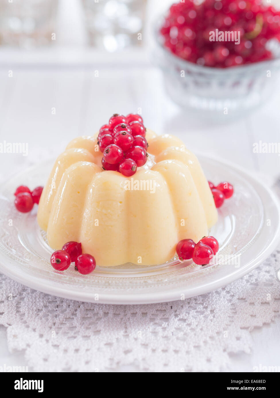 Vanilla pudding with red currants Stock Photo - Alamy