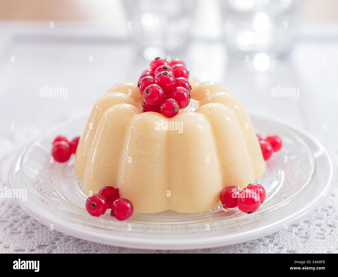 Vanilla pudding with red currants Stock Photo - Alamy