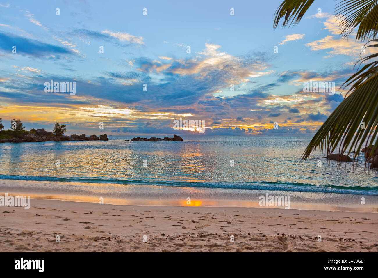 Seychelles tropical beach at sunset Stock Photo - Alamy