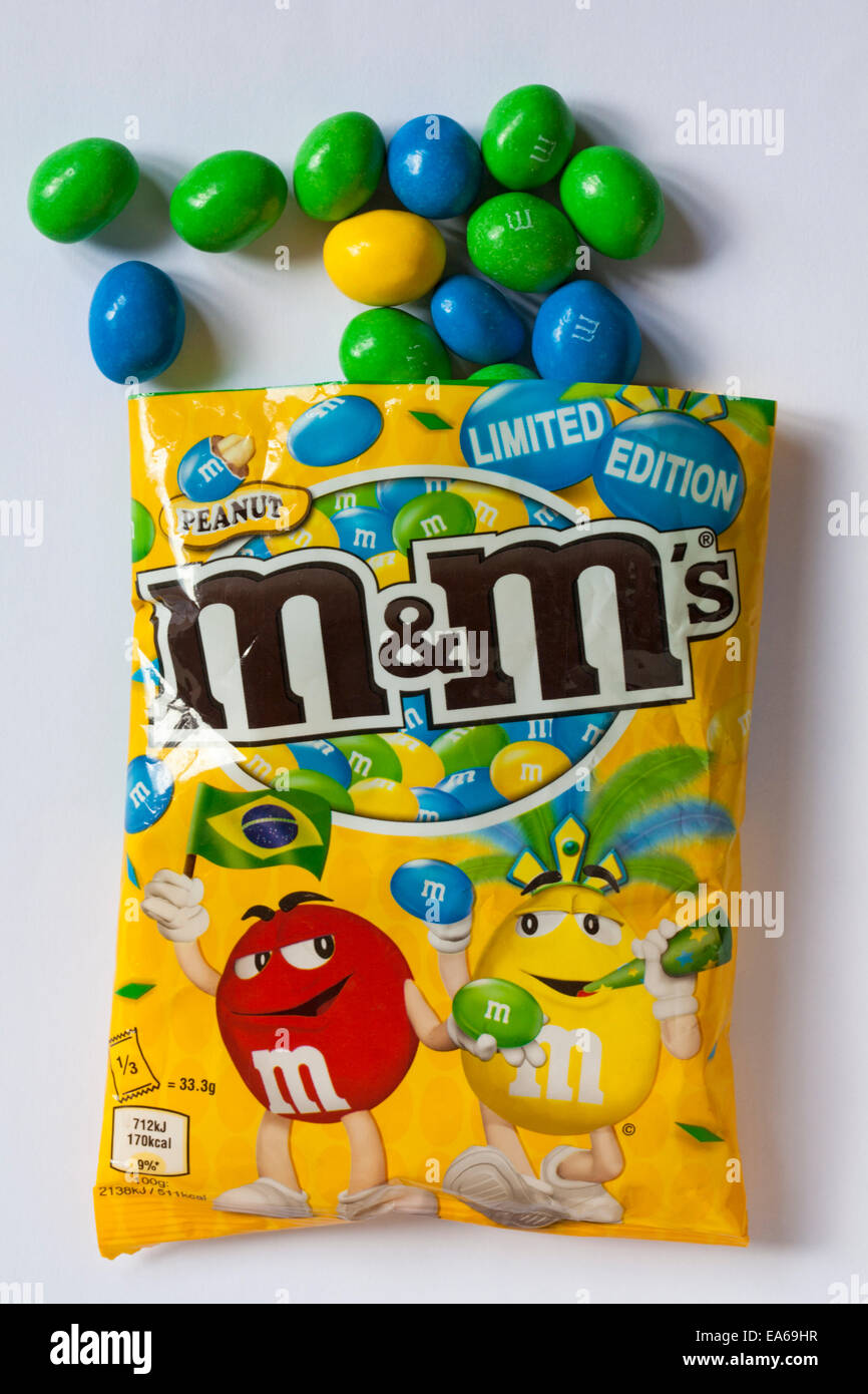 Limited Edition peanut M&Ms with contents spilled spilt on white ...