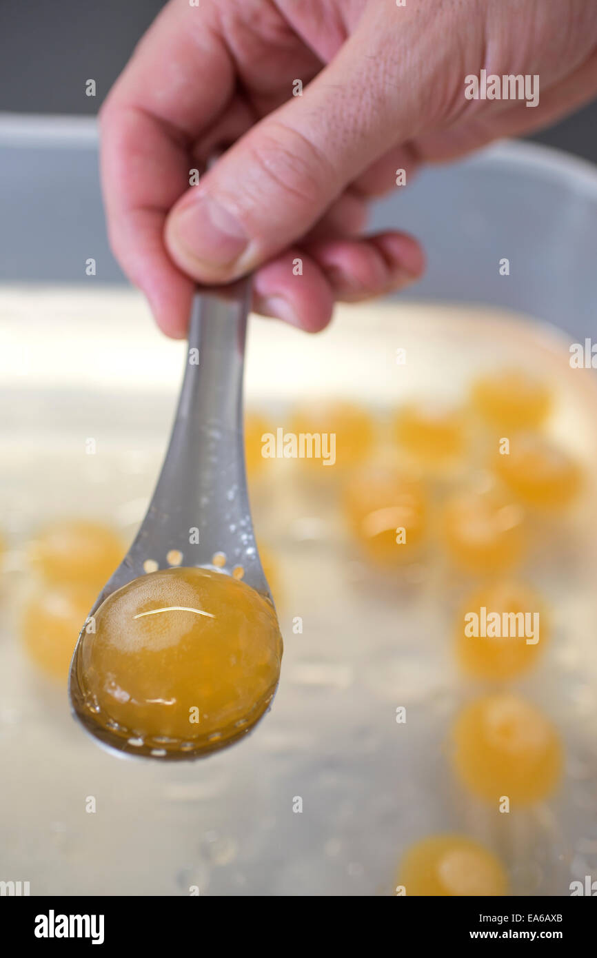 Yolk-like spheres of vodka and tomato 'Prairie Oyster' cocktail ...