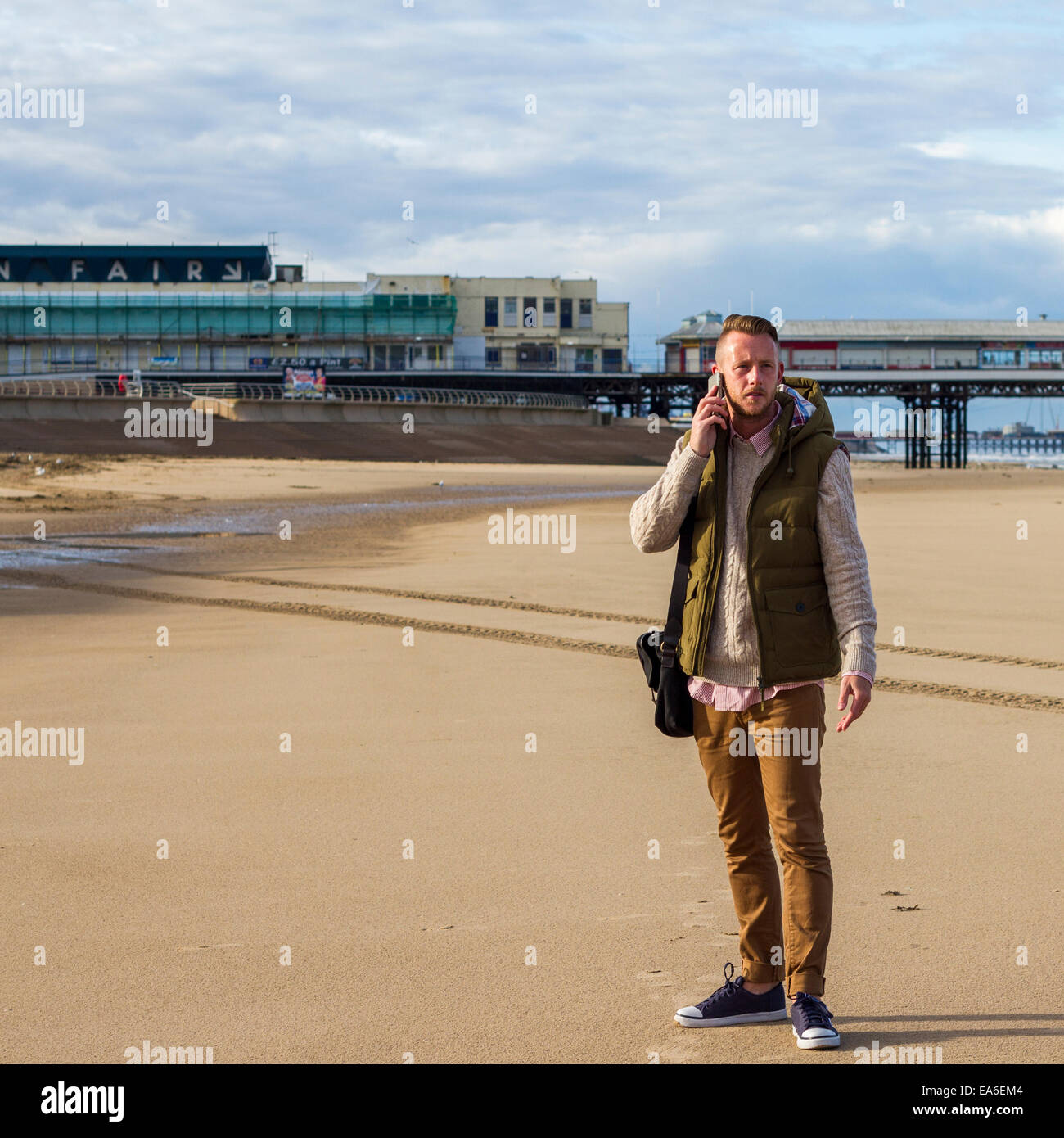 UK, Blackpool, Man with mobile phone on beach Stock Photo - Alamy