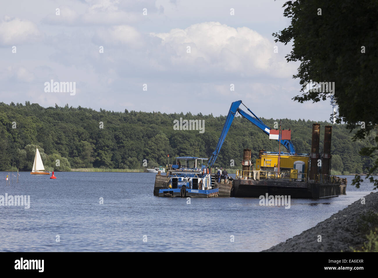 Excavators and ship in port Stock Photo - Alamy