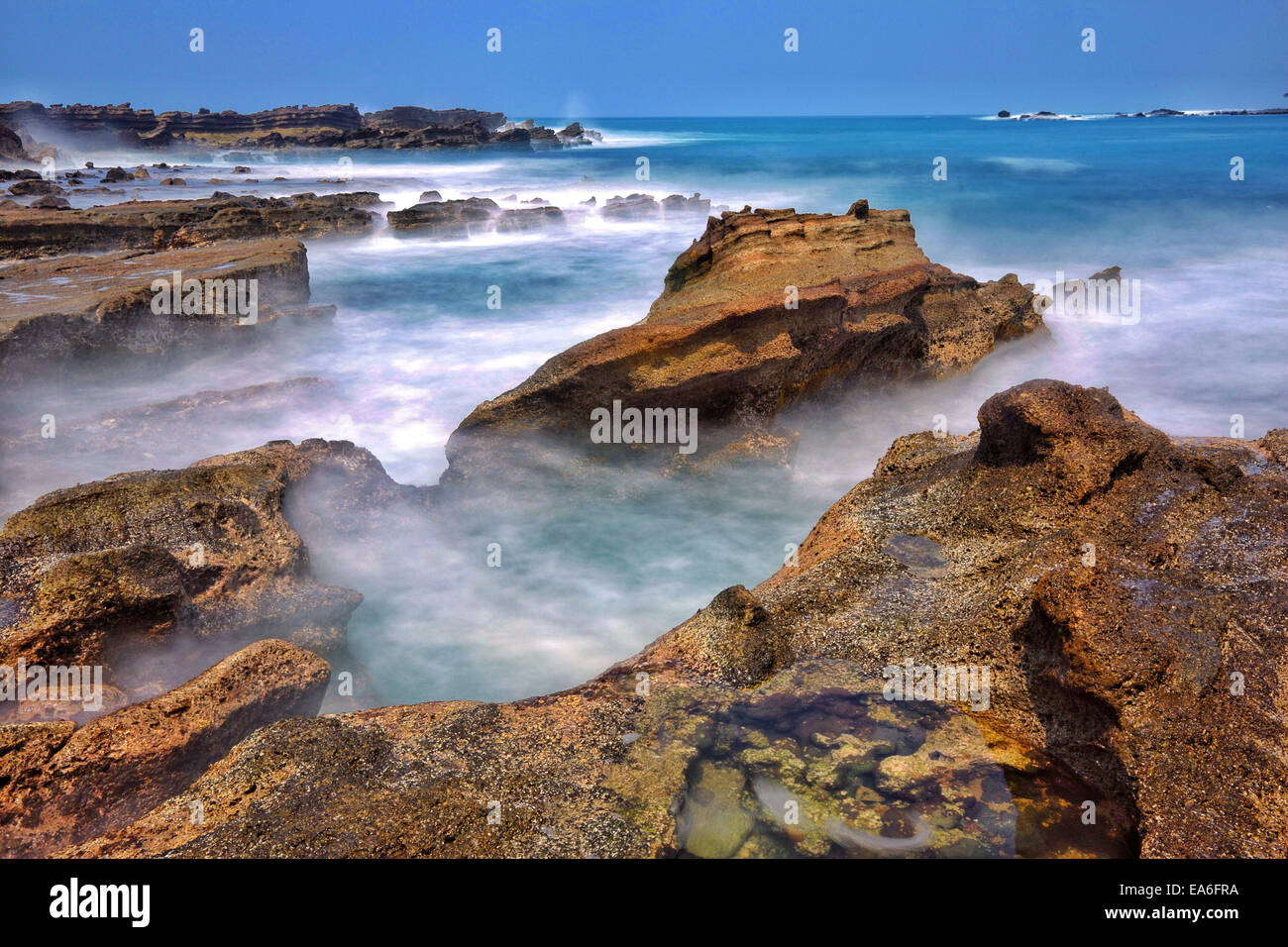 Indonesia, Sawarna, Karang Taraje, Strong waves flowing into rocks ...