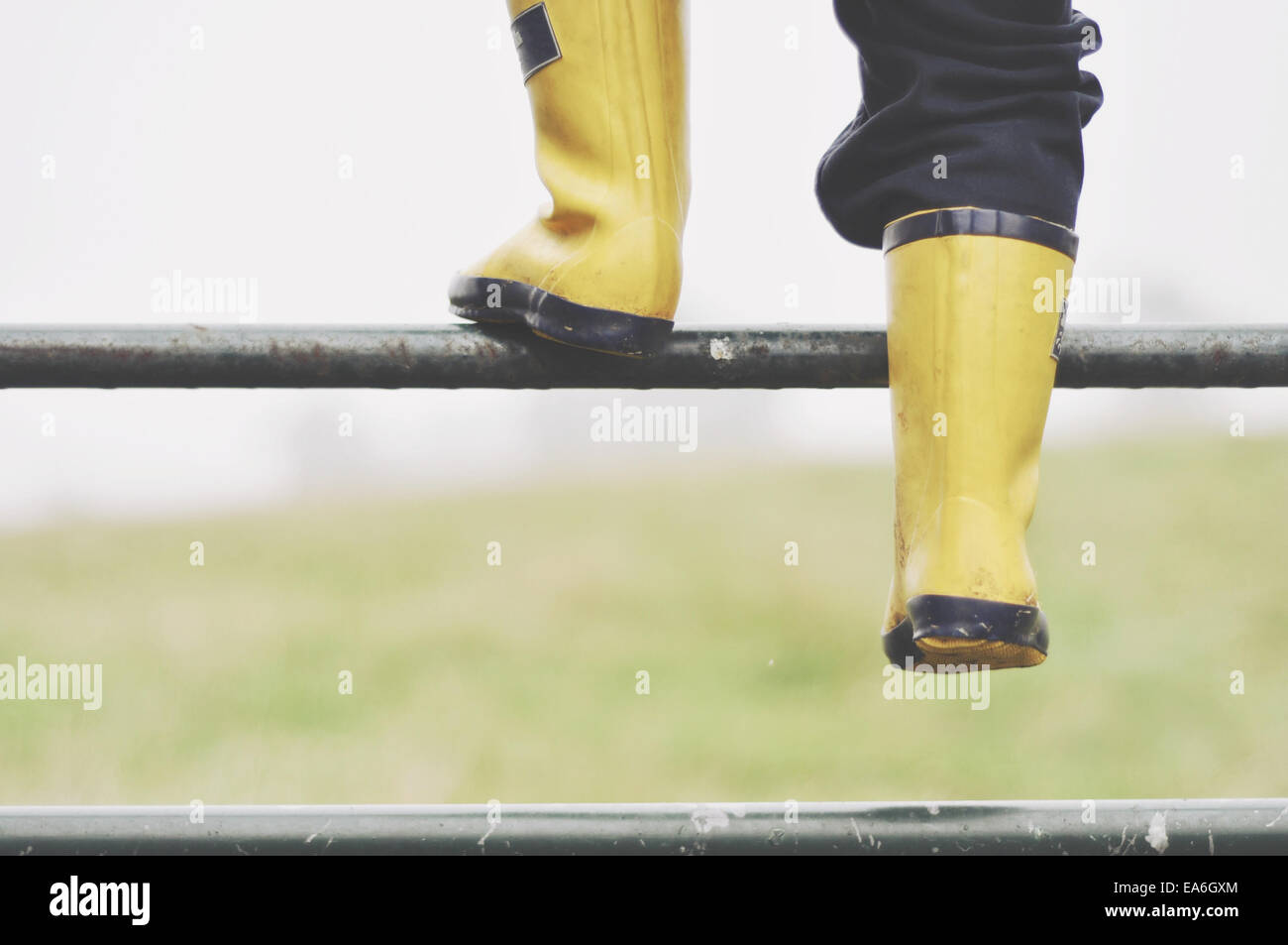 Man climbing over fence hi-res stock photography and images - Alamy
