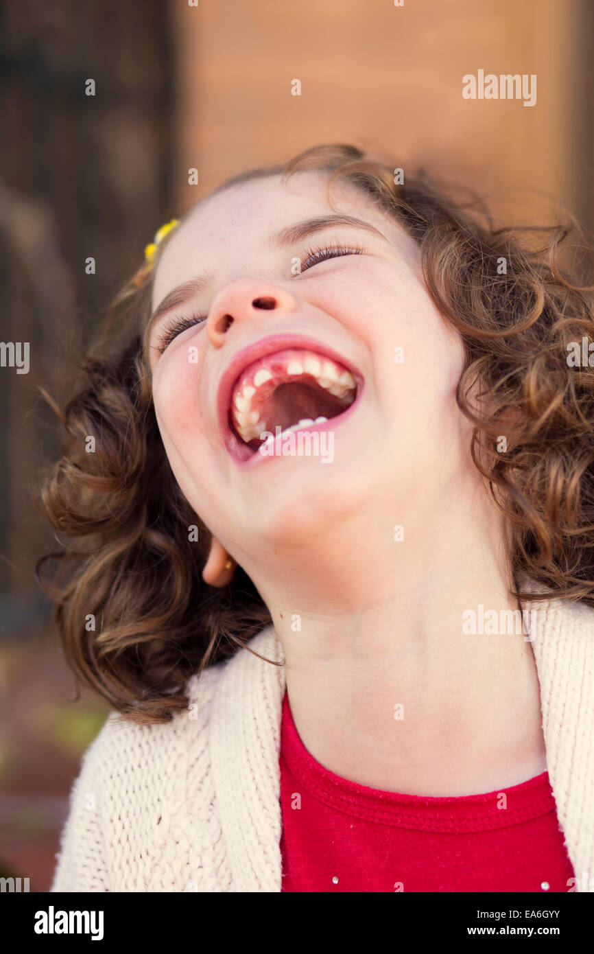 Portrait of a girl laughing Stock Photo - Alamy