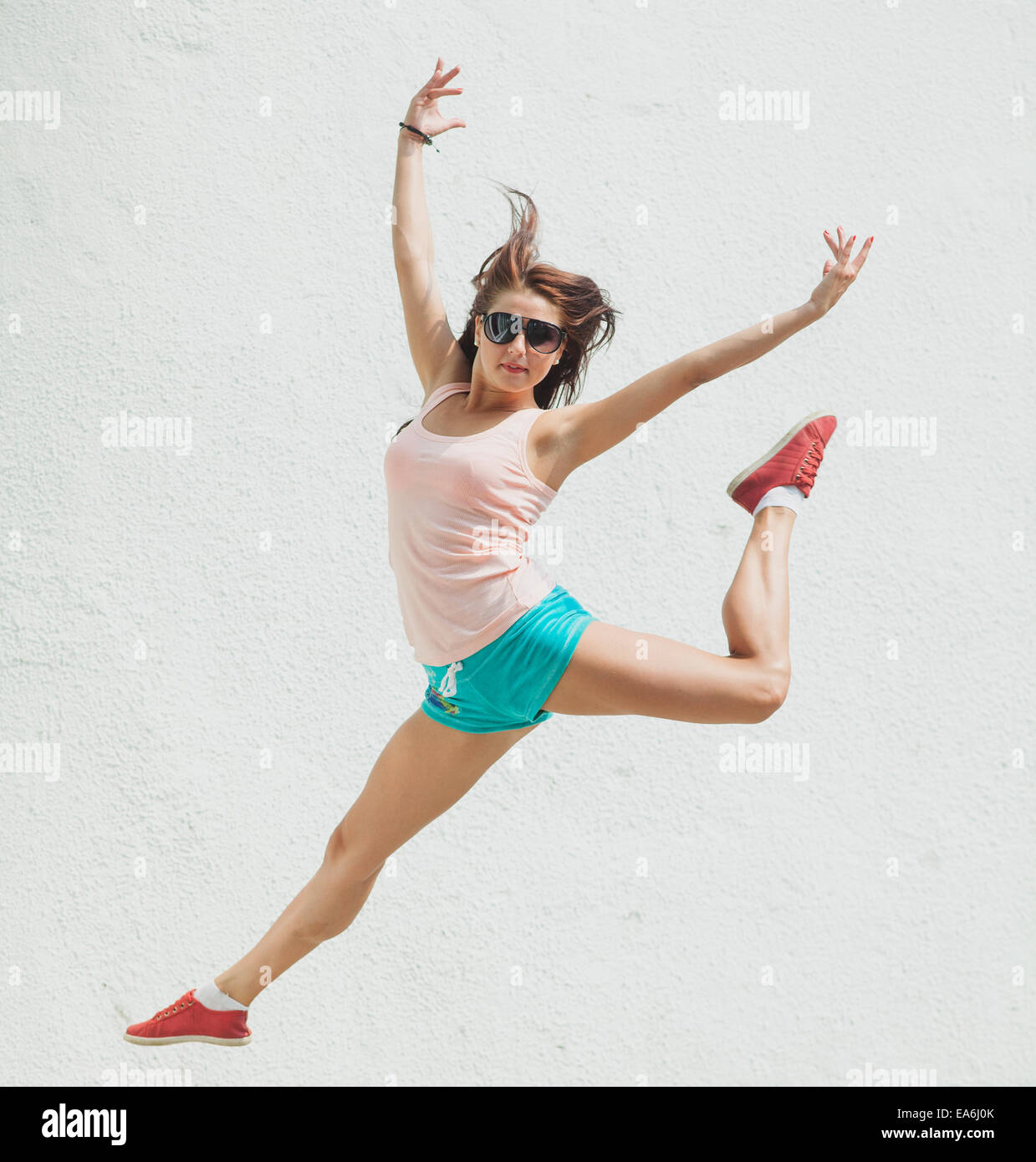Young excited girl jumping Stock Photo - Alamy