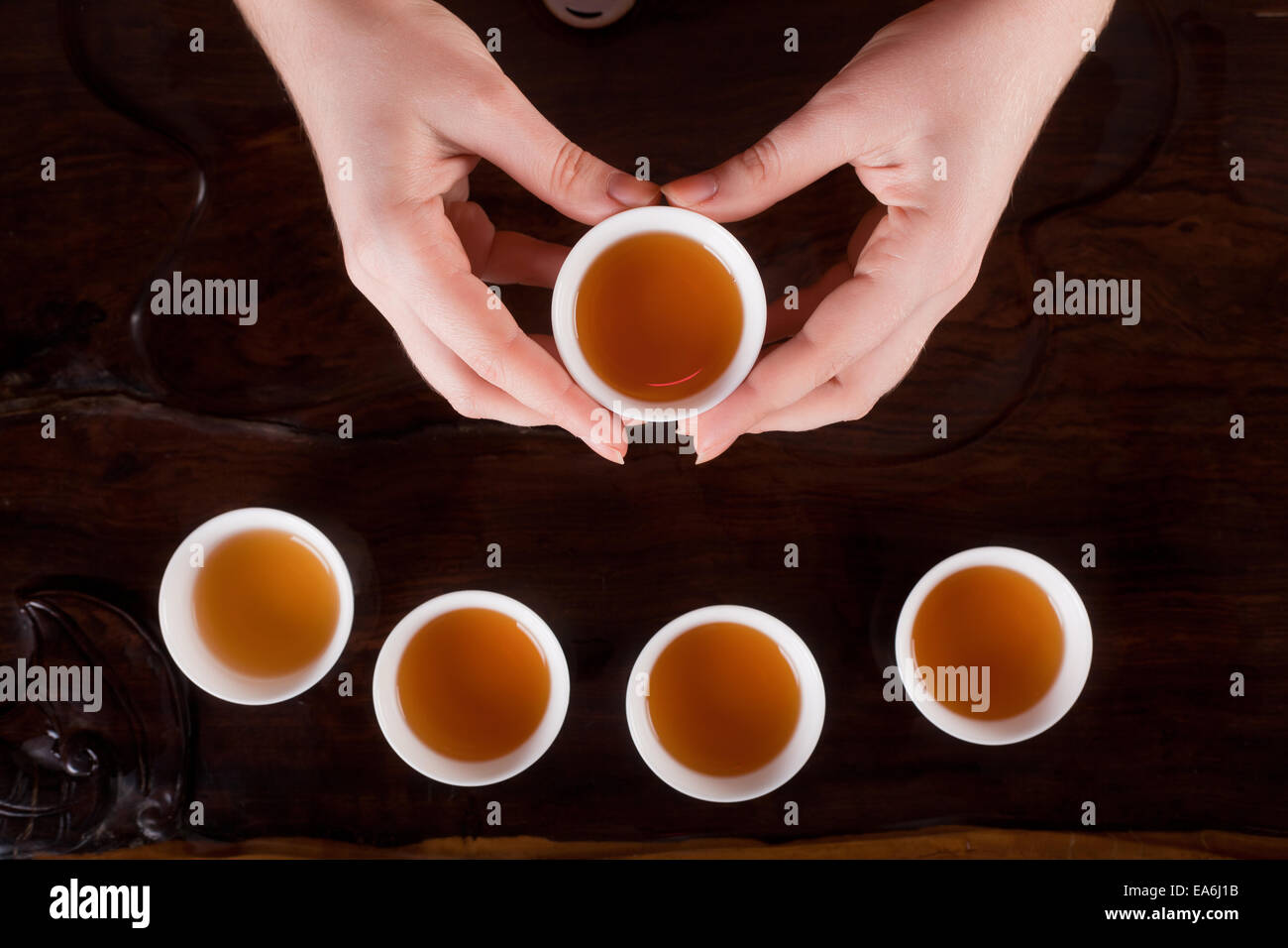 hands holding a cup of tea Stock Photo - Alamy