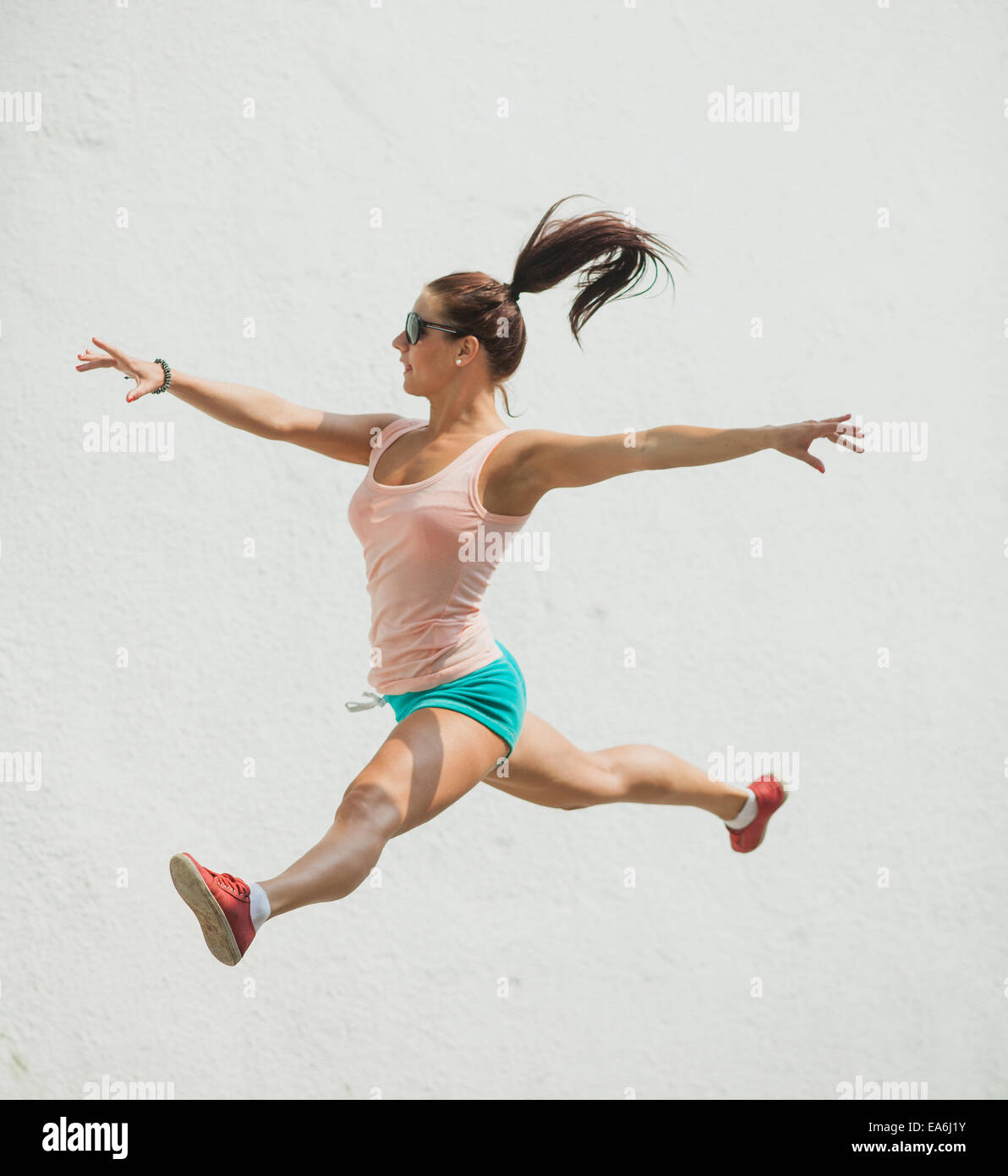 Young excited girl jumping Stock Photo - Alamy