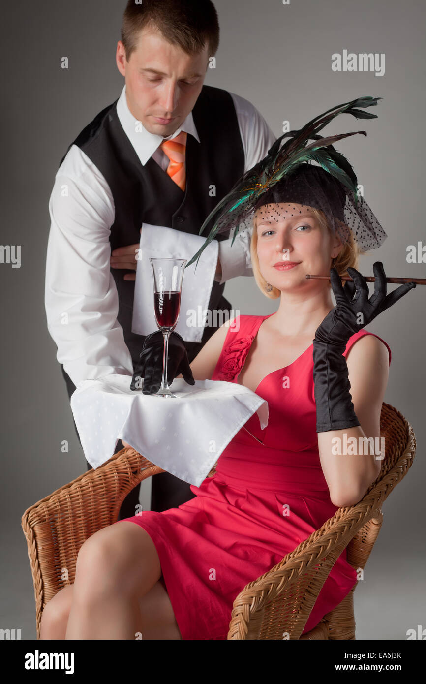 Female waiter serving wine hi-res stock photography and images - Alamy