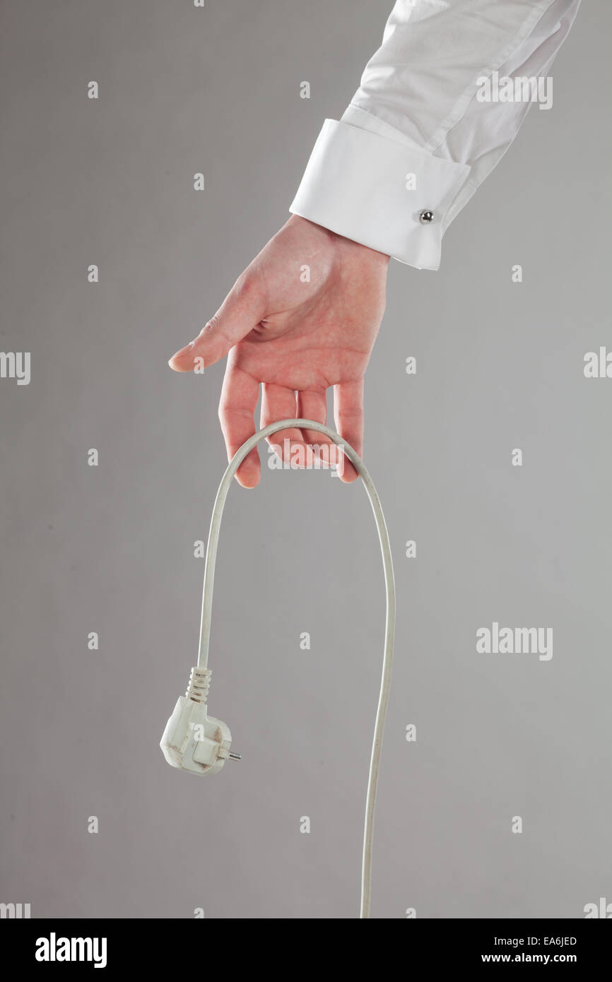 Hand and plug hi-res stock photography and images - Alamy