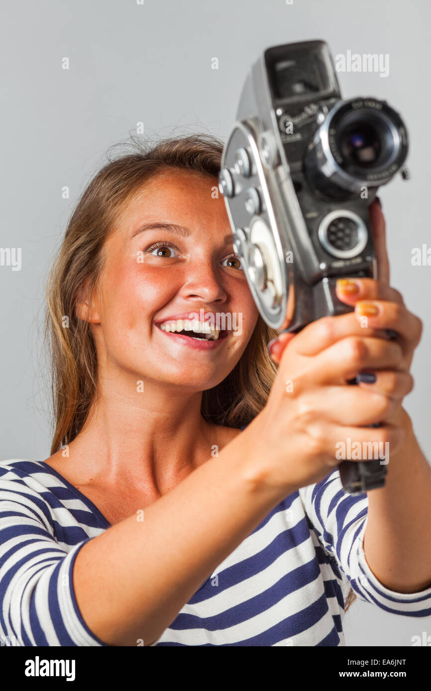 girl with an 8mm retro movie camera Stock Photo - Alamy