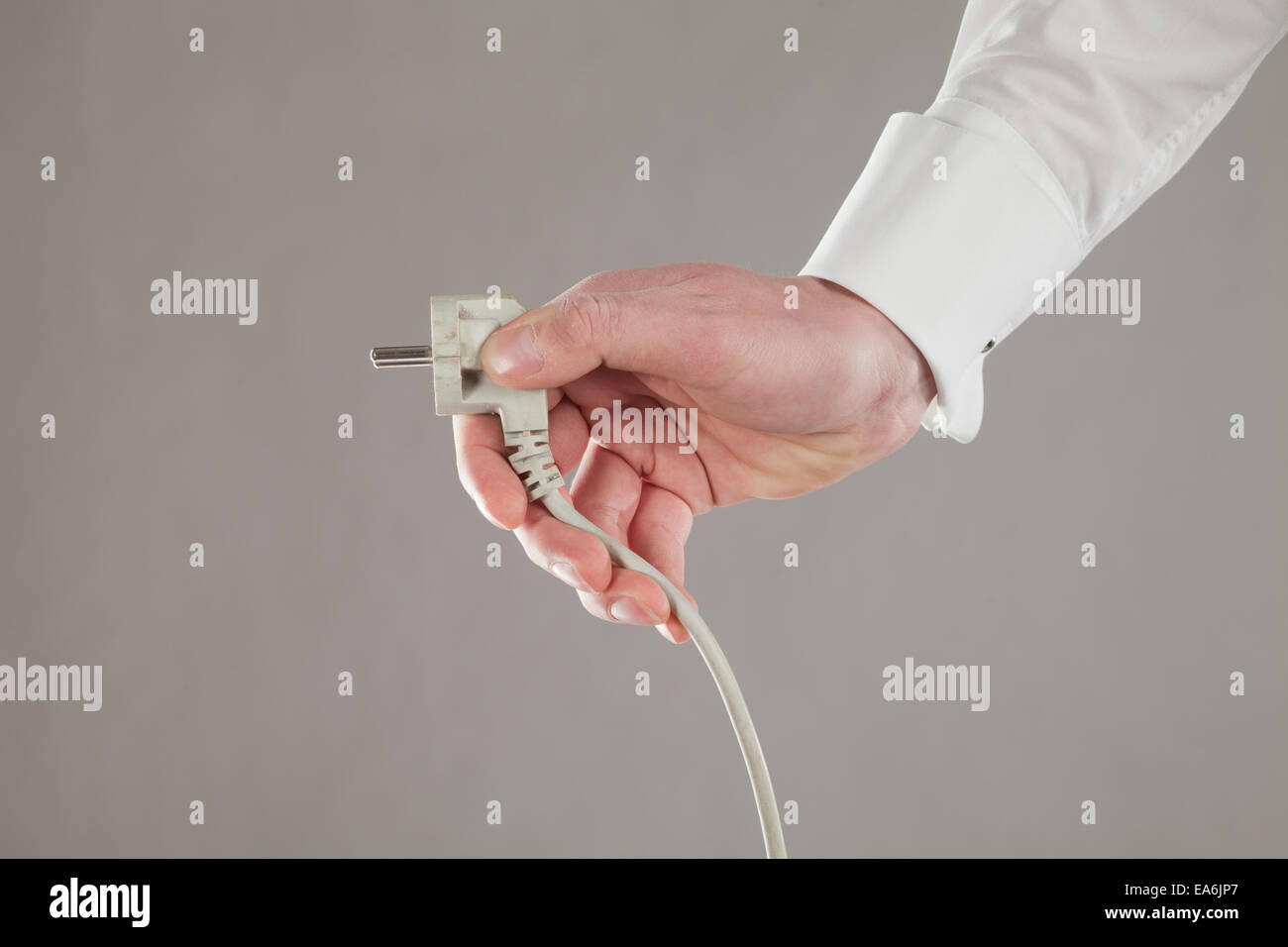 hand and plug Stock Photo - Alamy