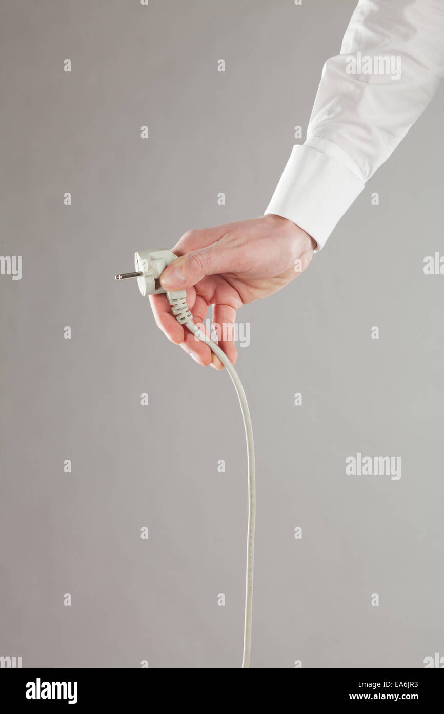 hand and plug Stock Photo - Alamy