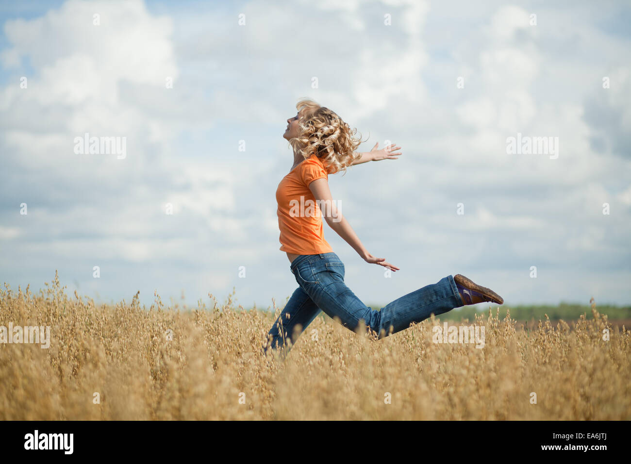 she runs and jumps Stock Photo - Alamy