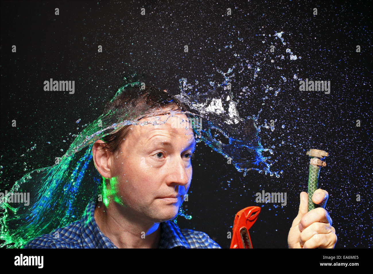 worker with water tool Stock Photo - Alamy