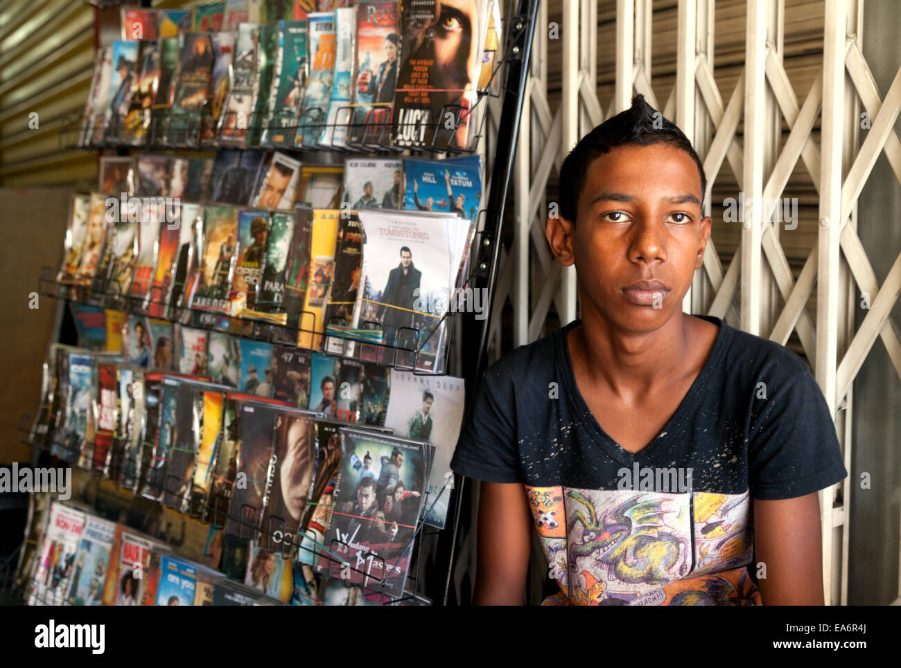 Mauritian man selling DVD films from his market stall, Flacq town ...