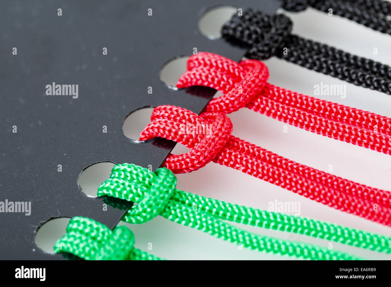 Knots on the Colorful Cords, close up Stock Photo - Alamy
