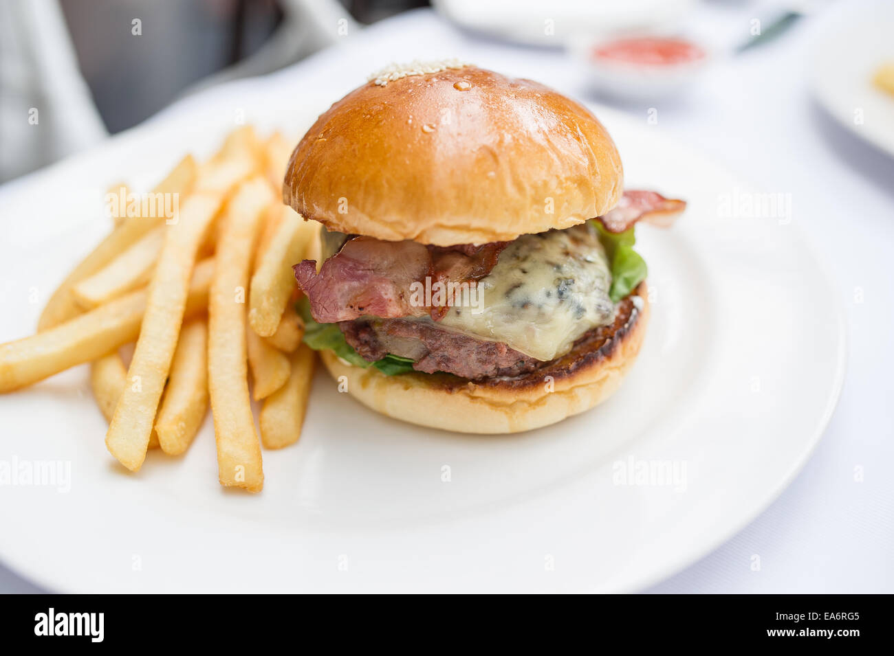Melting cheese burger with french fries Stock Photo - Alamy