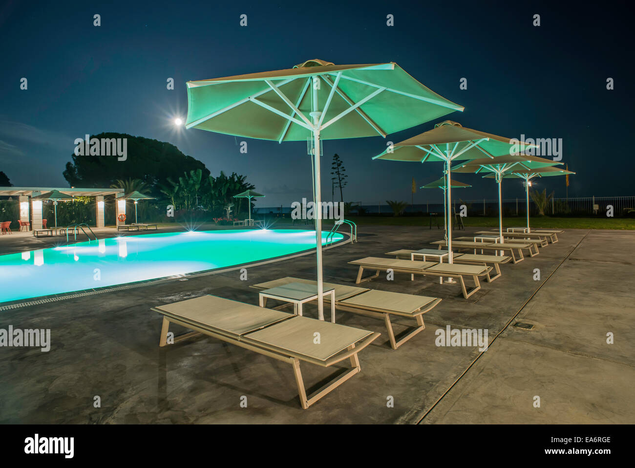 Blue swimming pool at night hi-res stock photography and images - Alamy