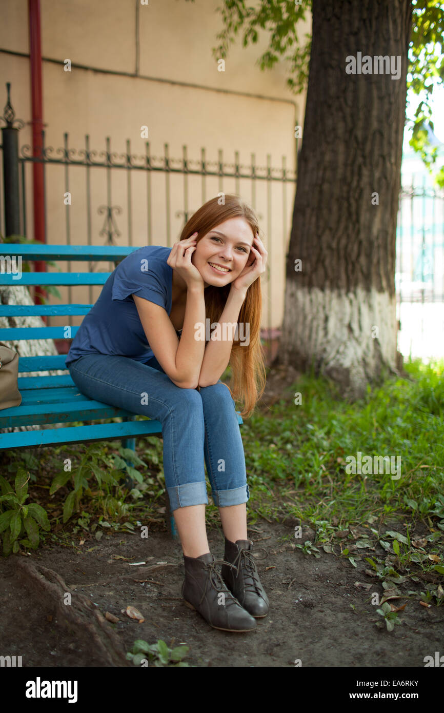 Person sitting on park bench hi-res stock photography and images - Alamy