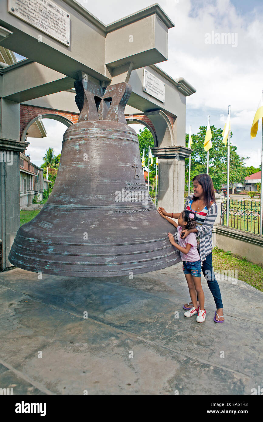 A Filipino woman and child visit The Santa Monica Parish Church which ...