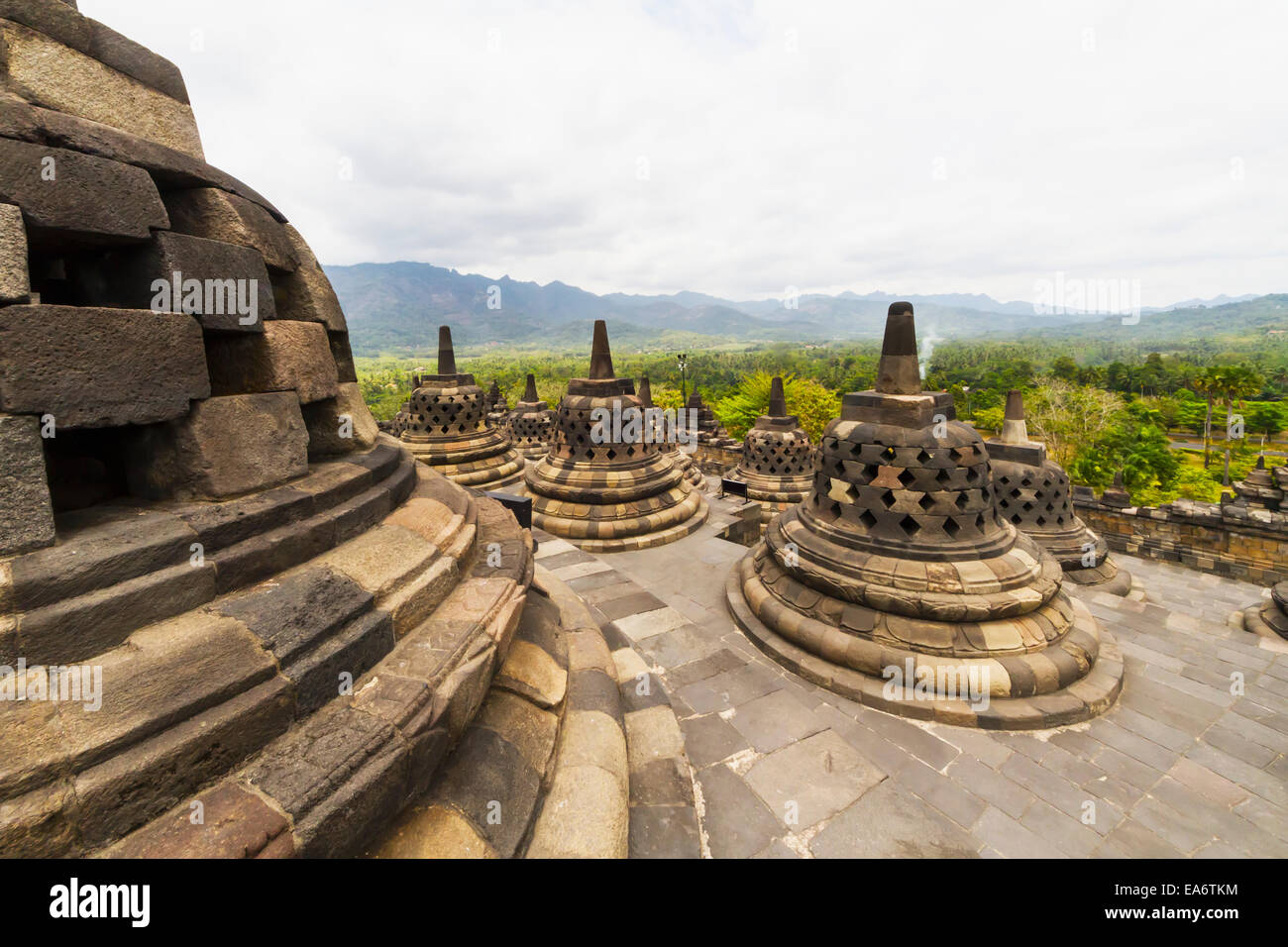 Latticed stone stupas containing Buddha statues on the upper terrace ...