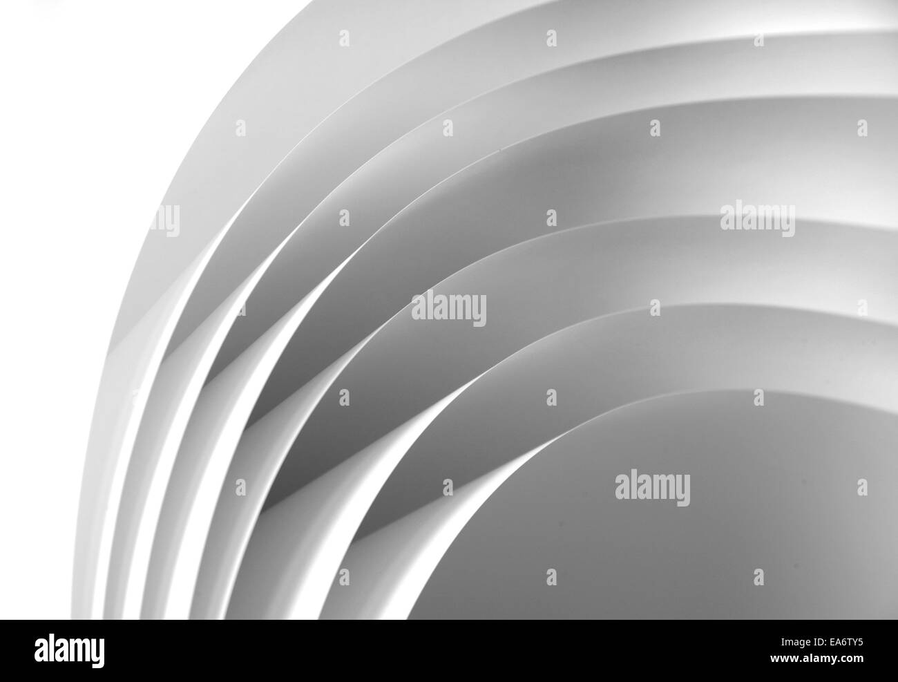 Sheets of paper being curled Stock Photo - Alamy