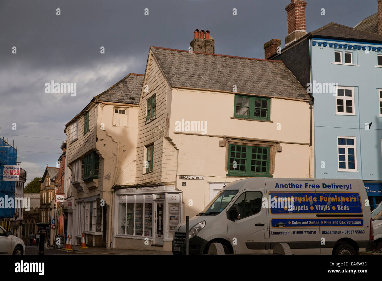 Storm clouds over the crooked buildings in Launceston Cornwall Stock ...