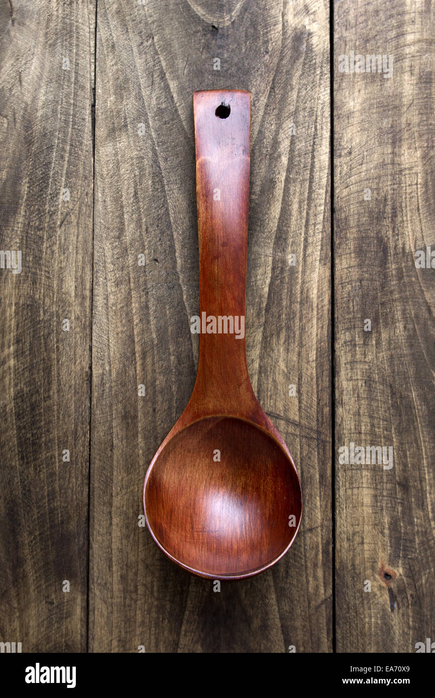 Wooden spoon on wooden table, from above Stock Photo - Alamy