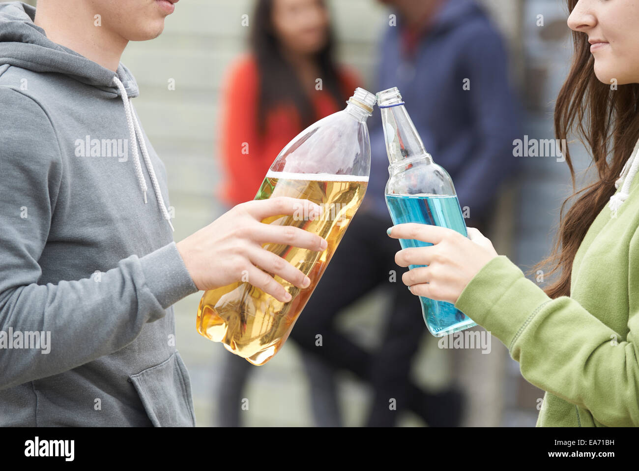 Close Up Of Teenage Group Drinking Alcohol Together Stock Photo - Alamy