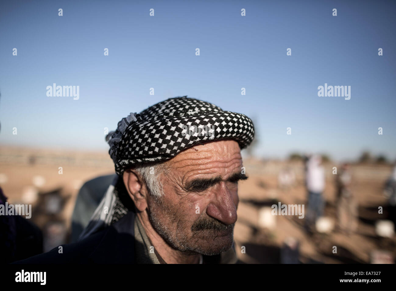 Suruc, Turkey. 07th Nov, 2014. A Kurdish elderly man watch the funeral ...