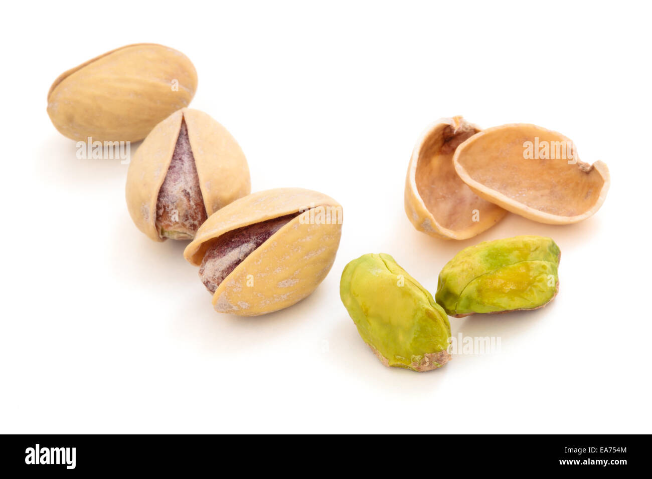 Whole and broken pistachios isolated on white background Stock Photo ...