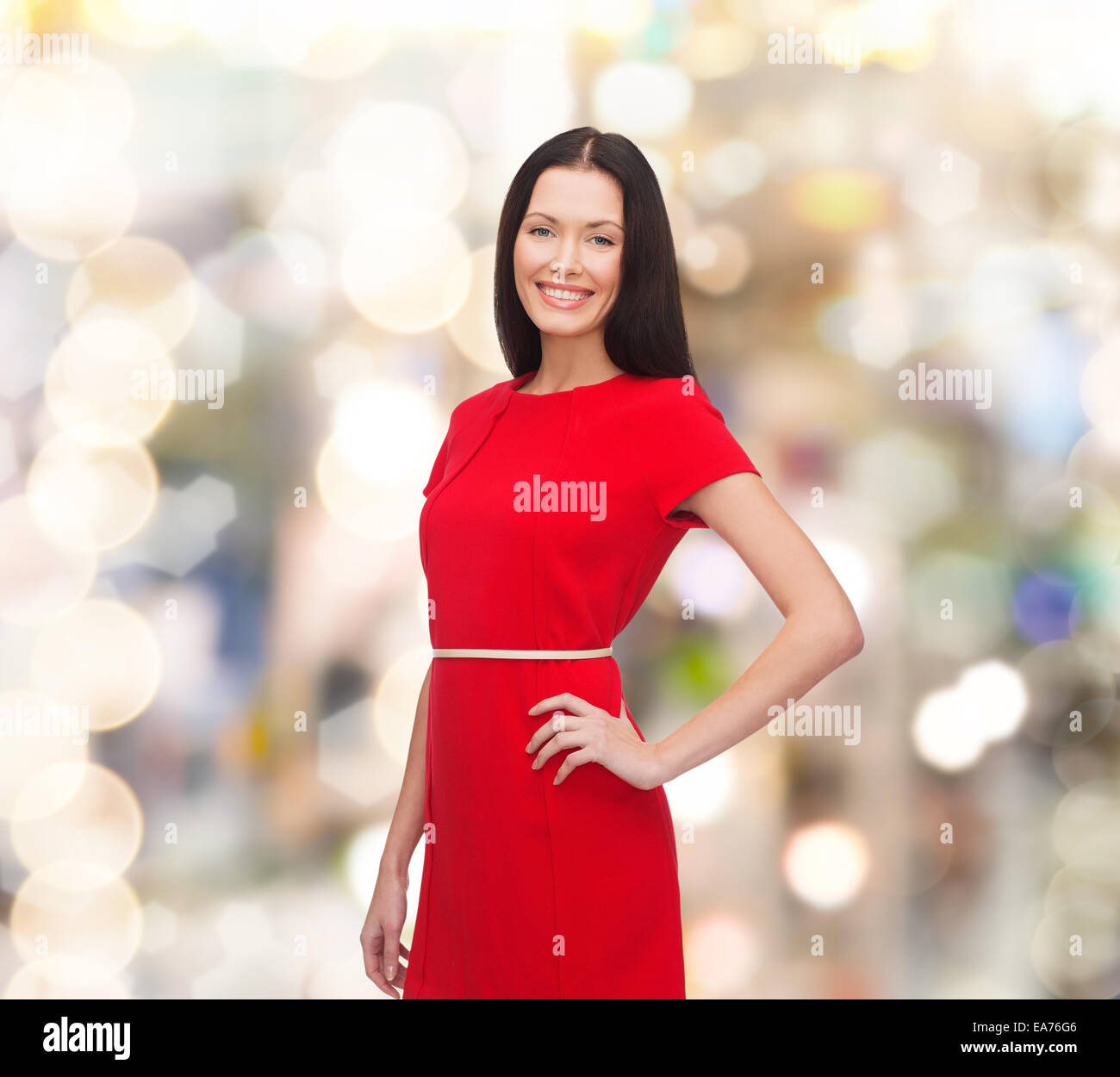 smiling woman in red dress Stock Photo - Alamy