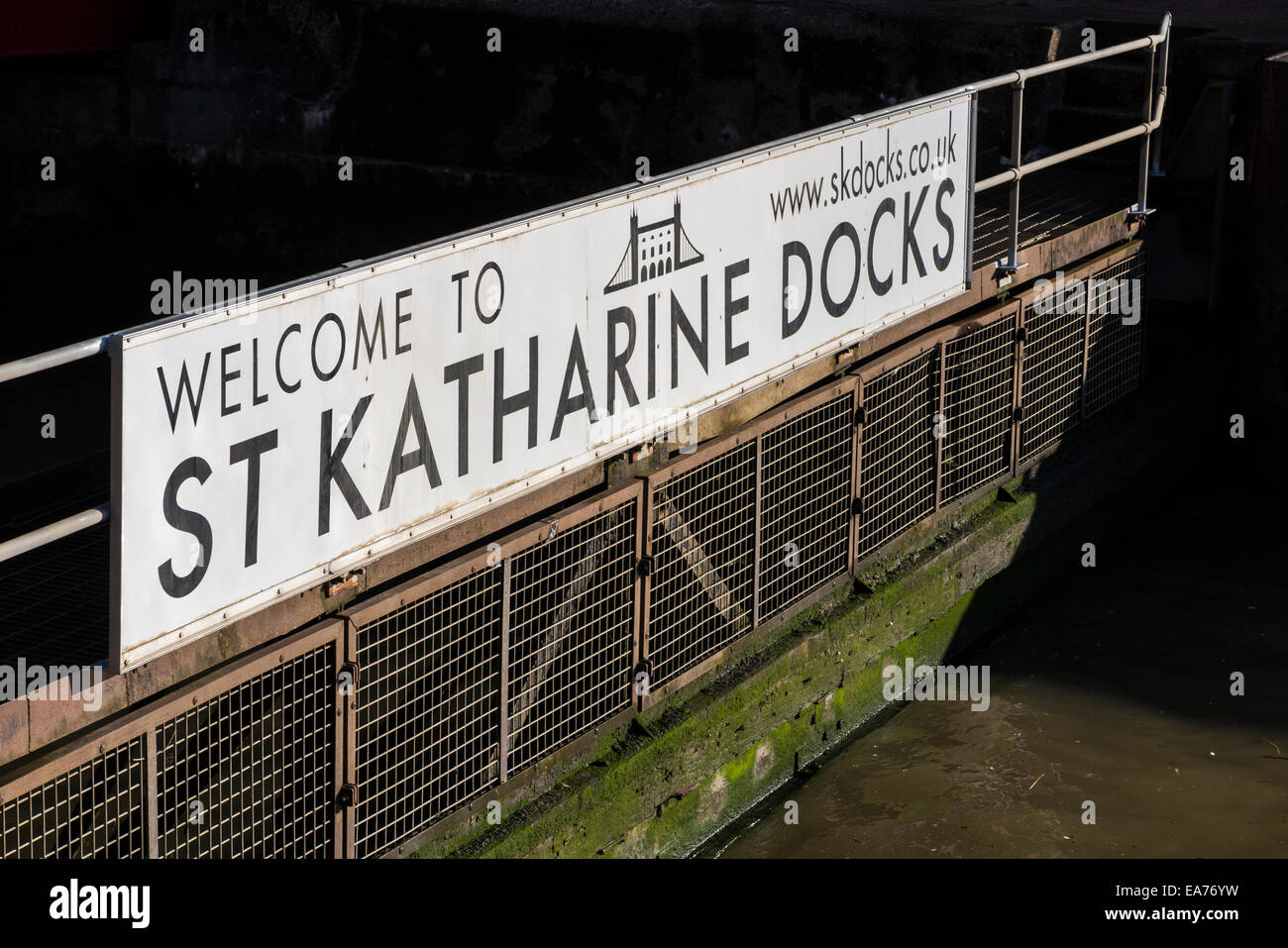 Welcome name sign at the entrance to St Katherine Docks from the River ...