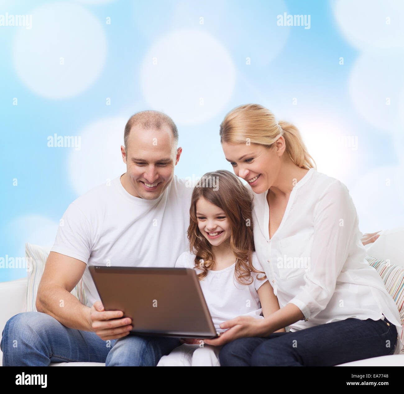 smiling family with laptop Stock Photo - Alamy