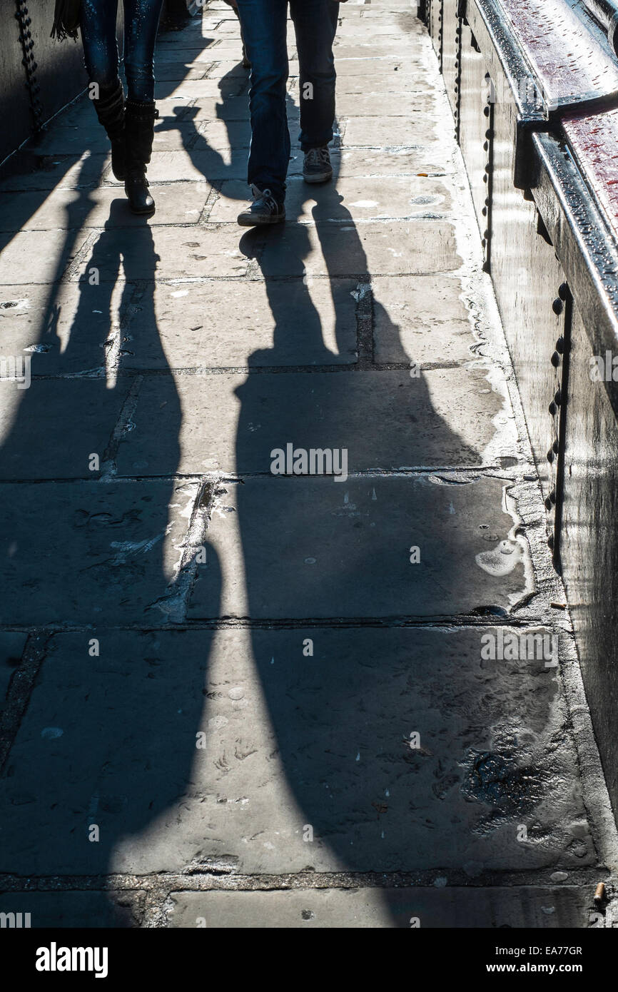 London shadow sidewalk walking people Stock Photo - Alamy