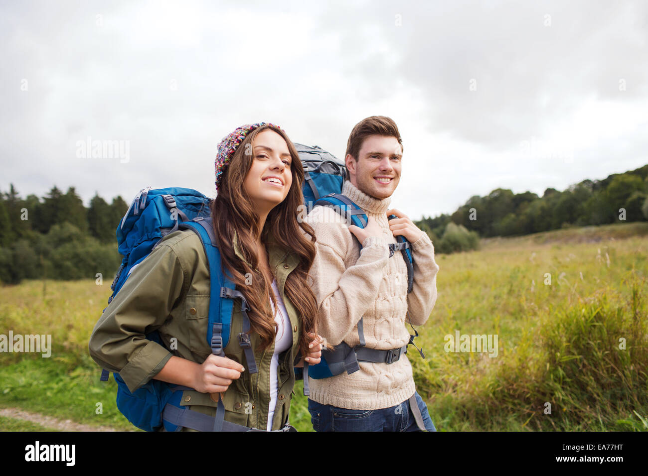 Teamwork travelers man woman backpacks hi-res stock photography and ...