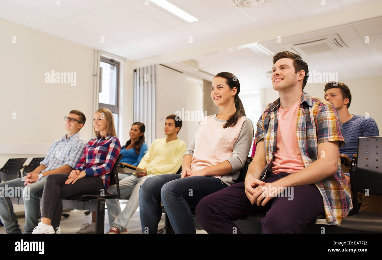 group of smiling students in lecture hall Stock Photo - Alamy