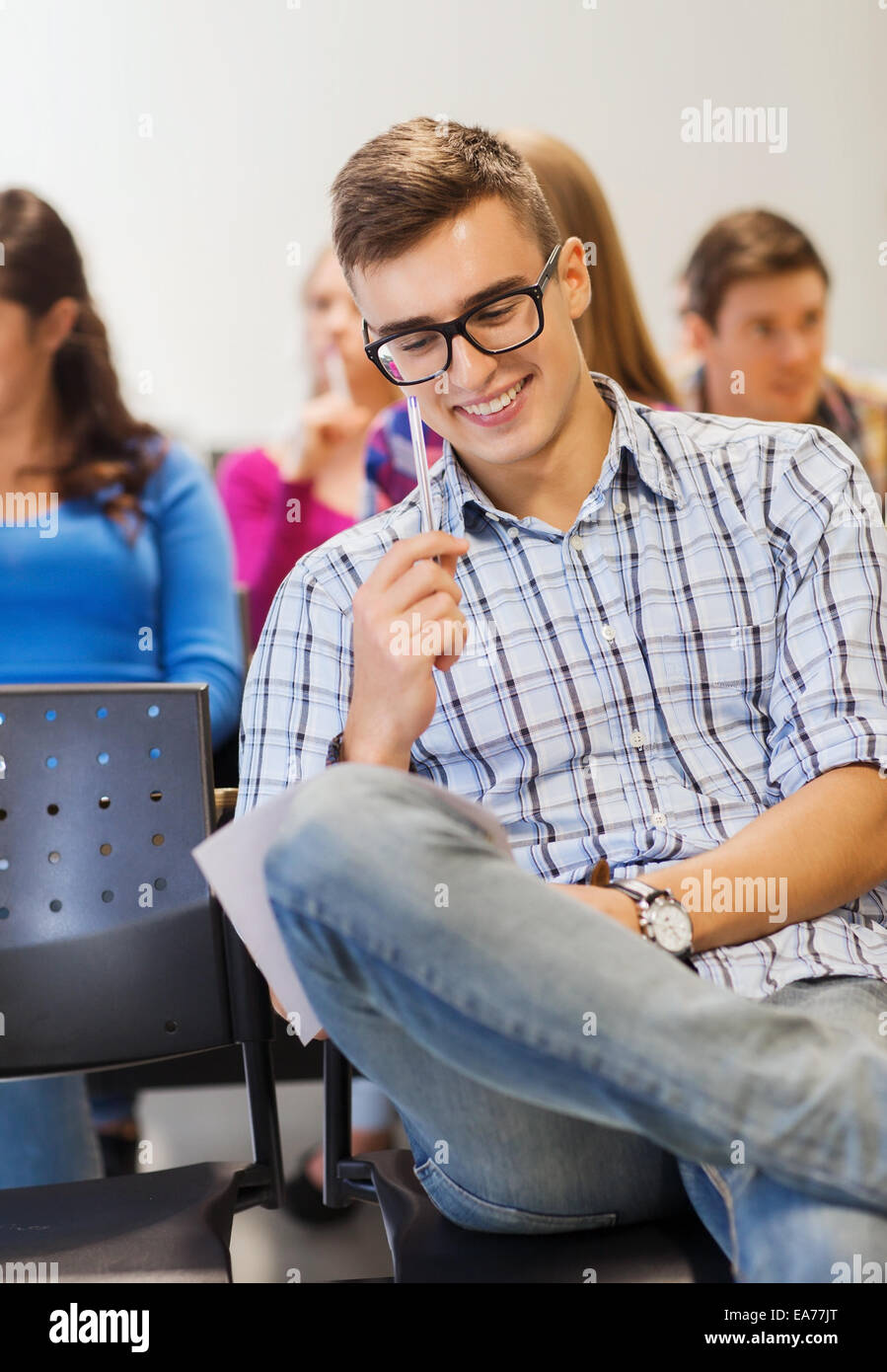 group of smiling students with notebook Stock Photo - Alamy