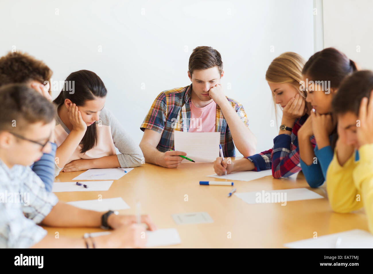 group of students with papers Stock Photo - Alamy