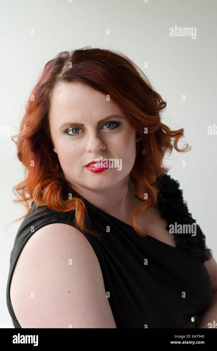 Studio portrait of gingerhead young adult woman Stock Photo - Alamy