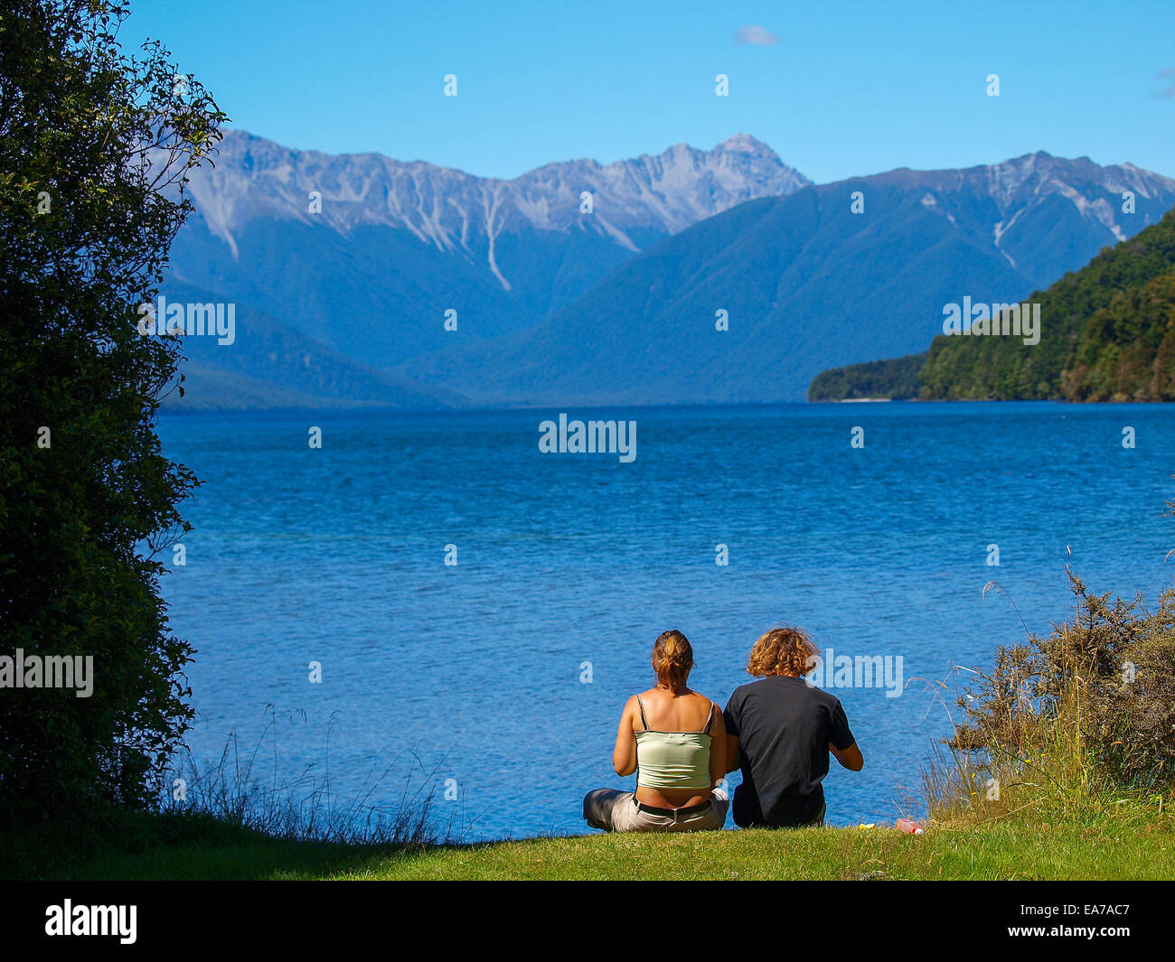 romantic date on nature, couple and lake Stock Photo - Alamy