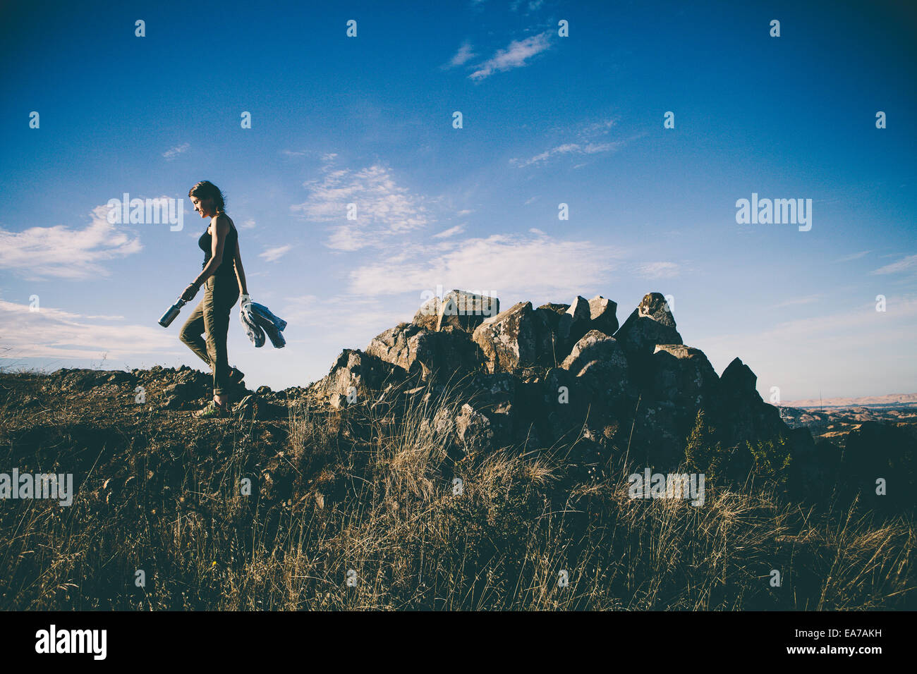 Women walking among rocks Stock Photo - Alamy