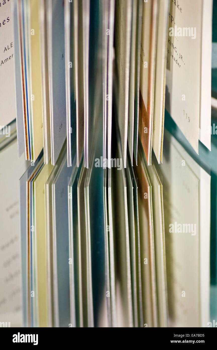 Close up of an open book sitting on a reflective surface Stock Photo ...