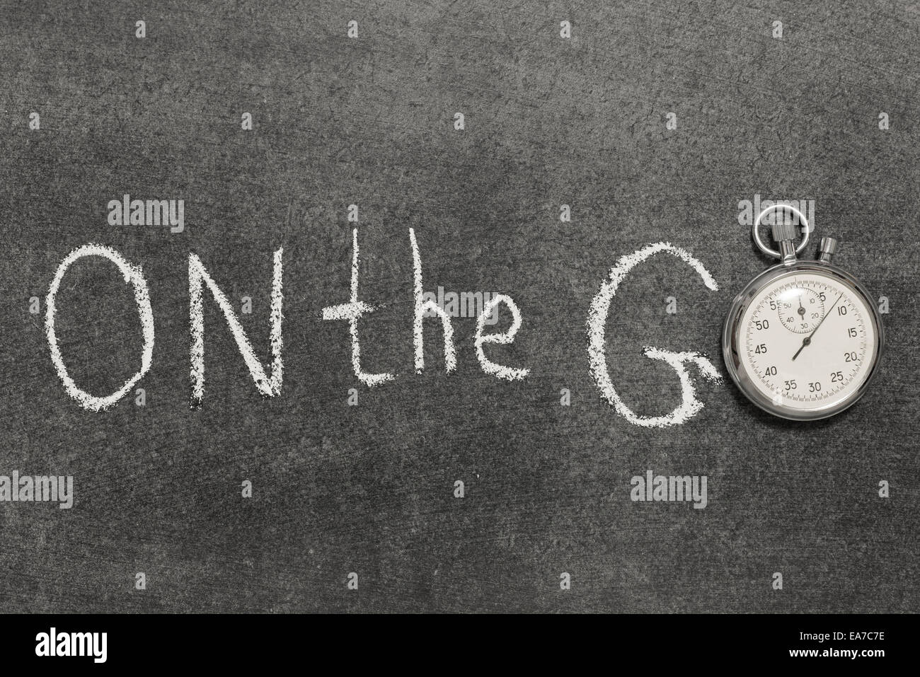 on the go phrase handwritten on chalkboard with vintage precise ...