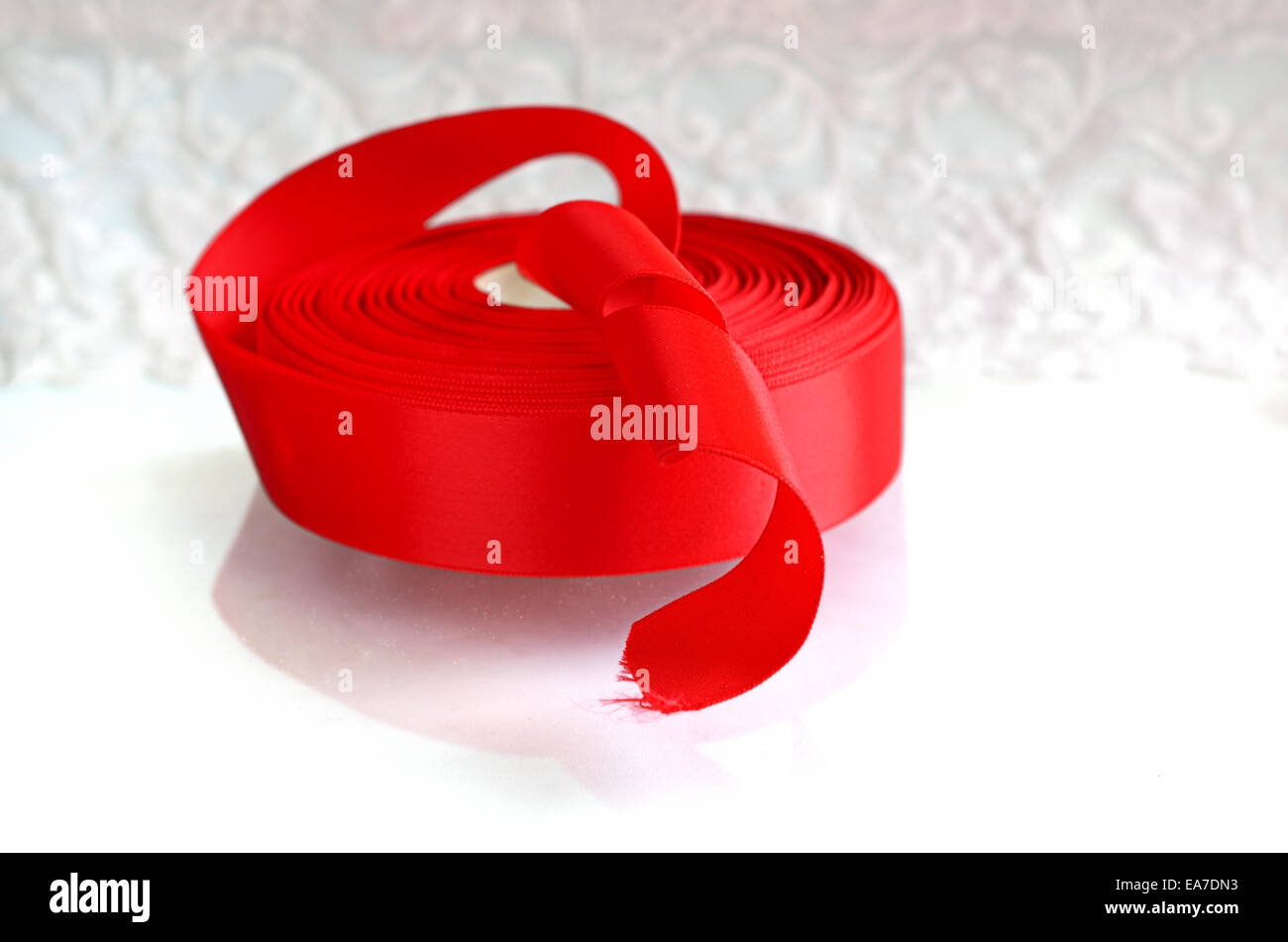 Red ribbon roll Stock Photo - Alamy