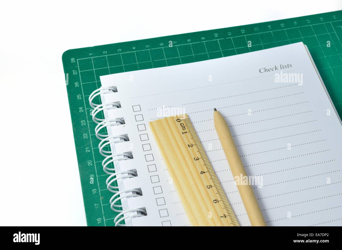 pen, ruler and notebook on cutting mat Stock Photo - Alamy