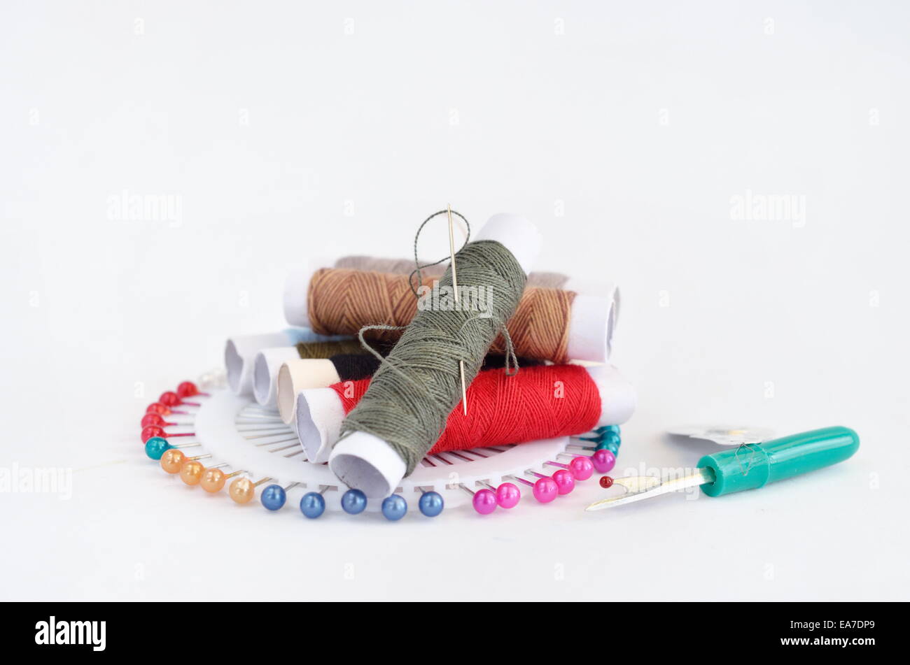 sewing accessories with pins, needle and thread Stock Photo - Alamy